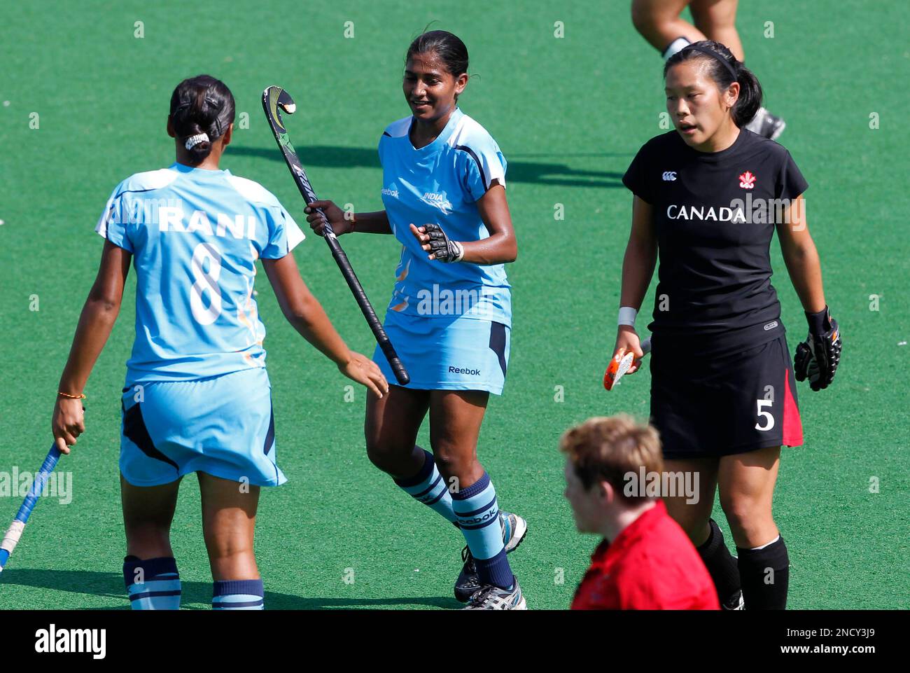 India's Ritu Rani, center, celebrates with teamate Rani Rampal, left ...