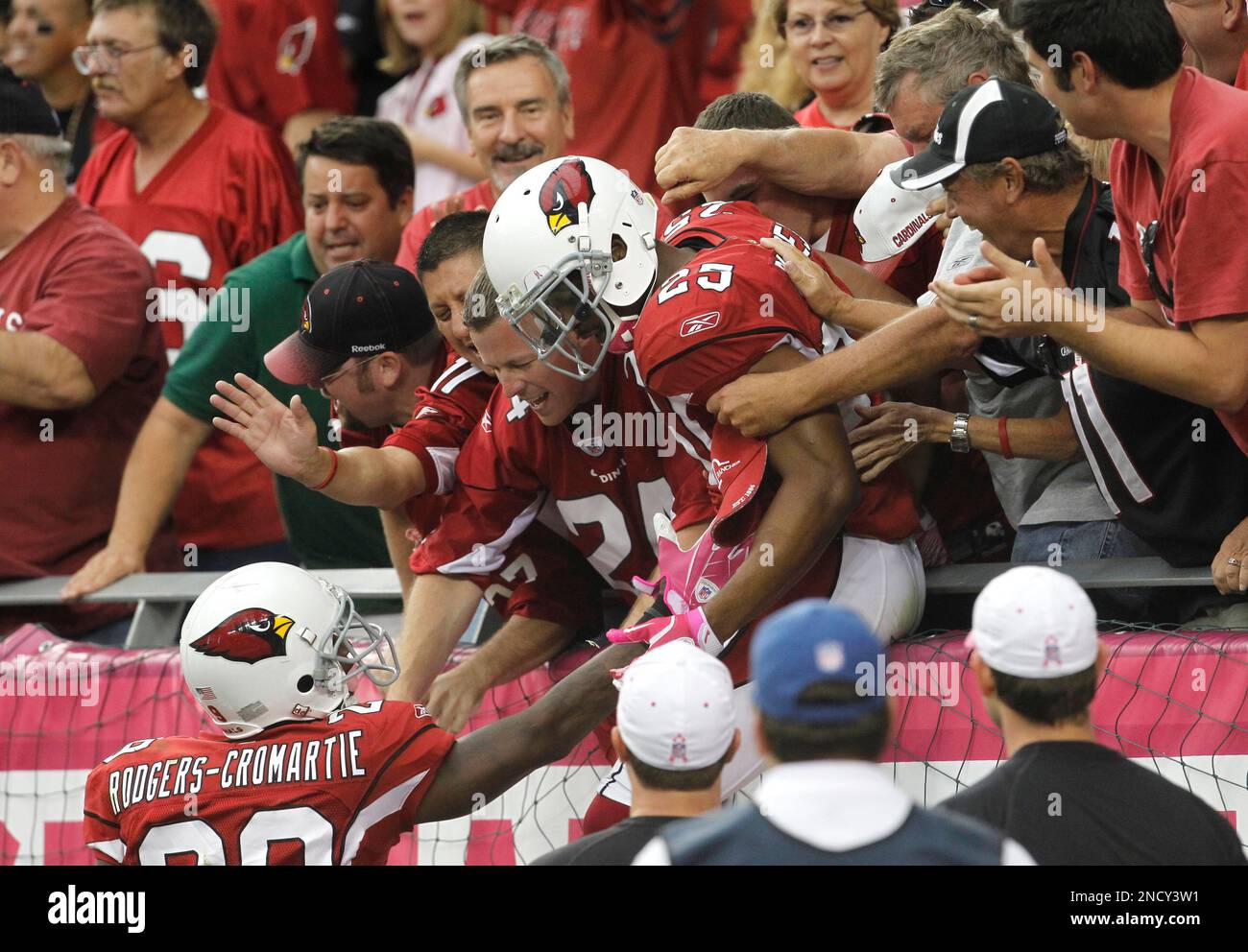 Arizona Cardinals' Kerry Rhodes (25) celebrates with fans and teammate ...