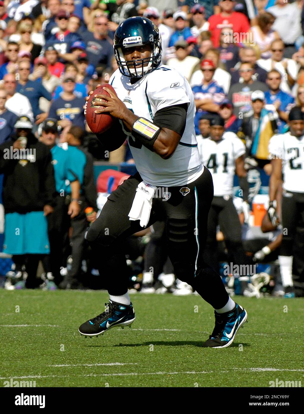 Jacksonville Jaguars quarterback David Garrard rolls out for a pass ...