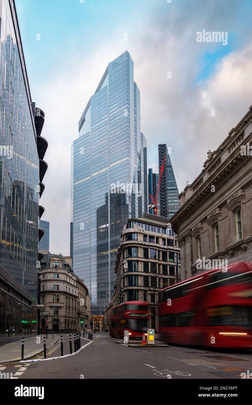 Traditional red buses driving through city of London, England, UK Stock ...