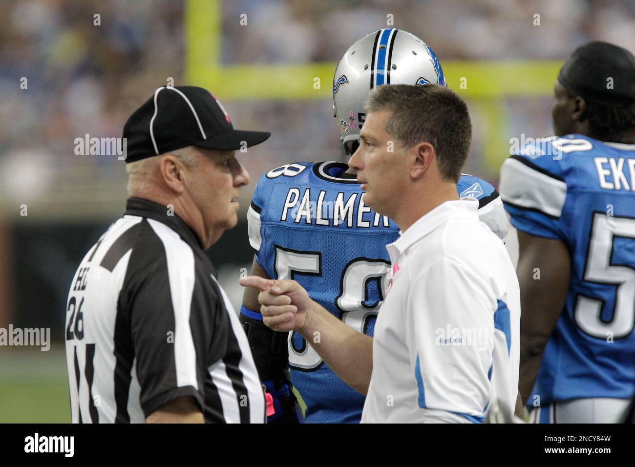 Detroit Lions head coach Jim Schwartz, right, talks with head linesman ...