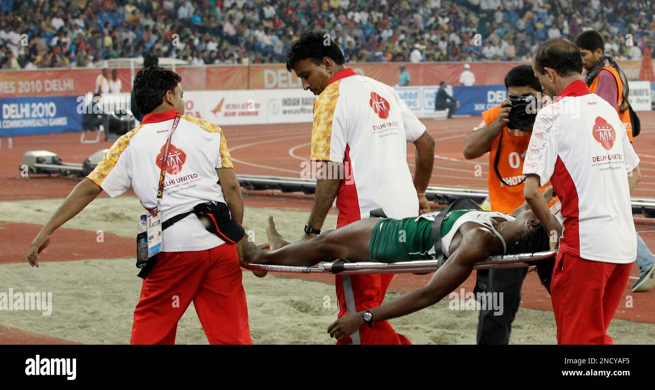 Nigeria's Comfort Onyali is carried off on a stretcher after collapsing ...