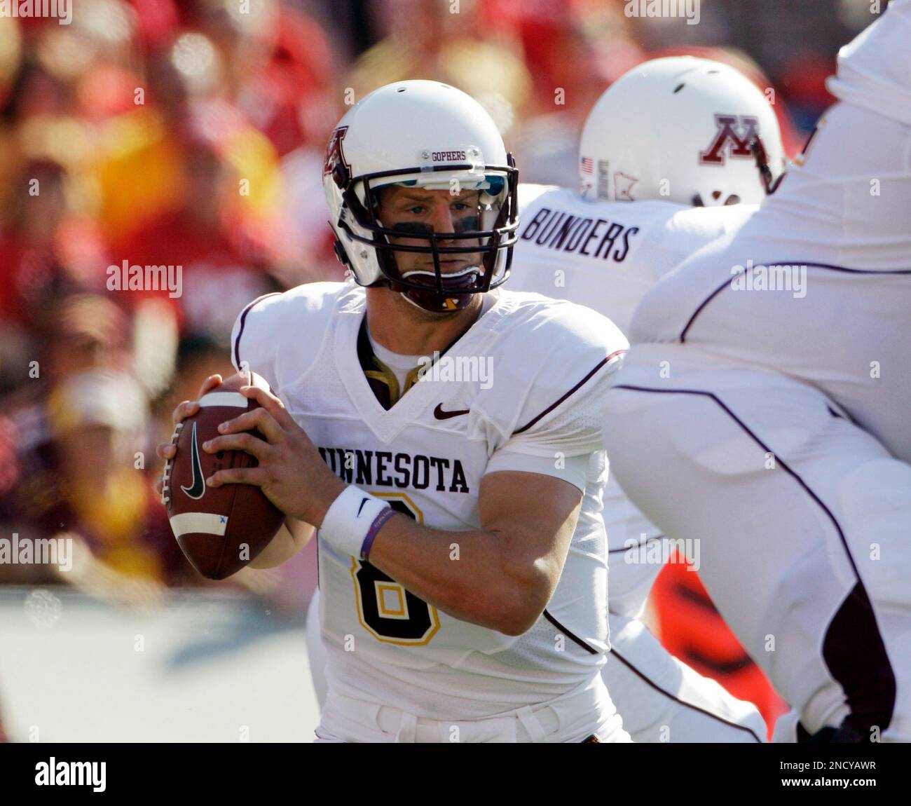Minnesota quarterback Adam Weber drops back to pass during the first ...