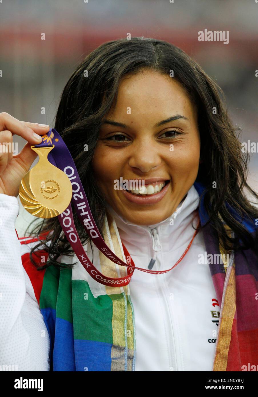 England's Louise Hazel poses with her gold medal for the Heptathlon ...