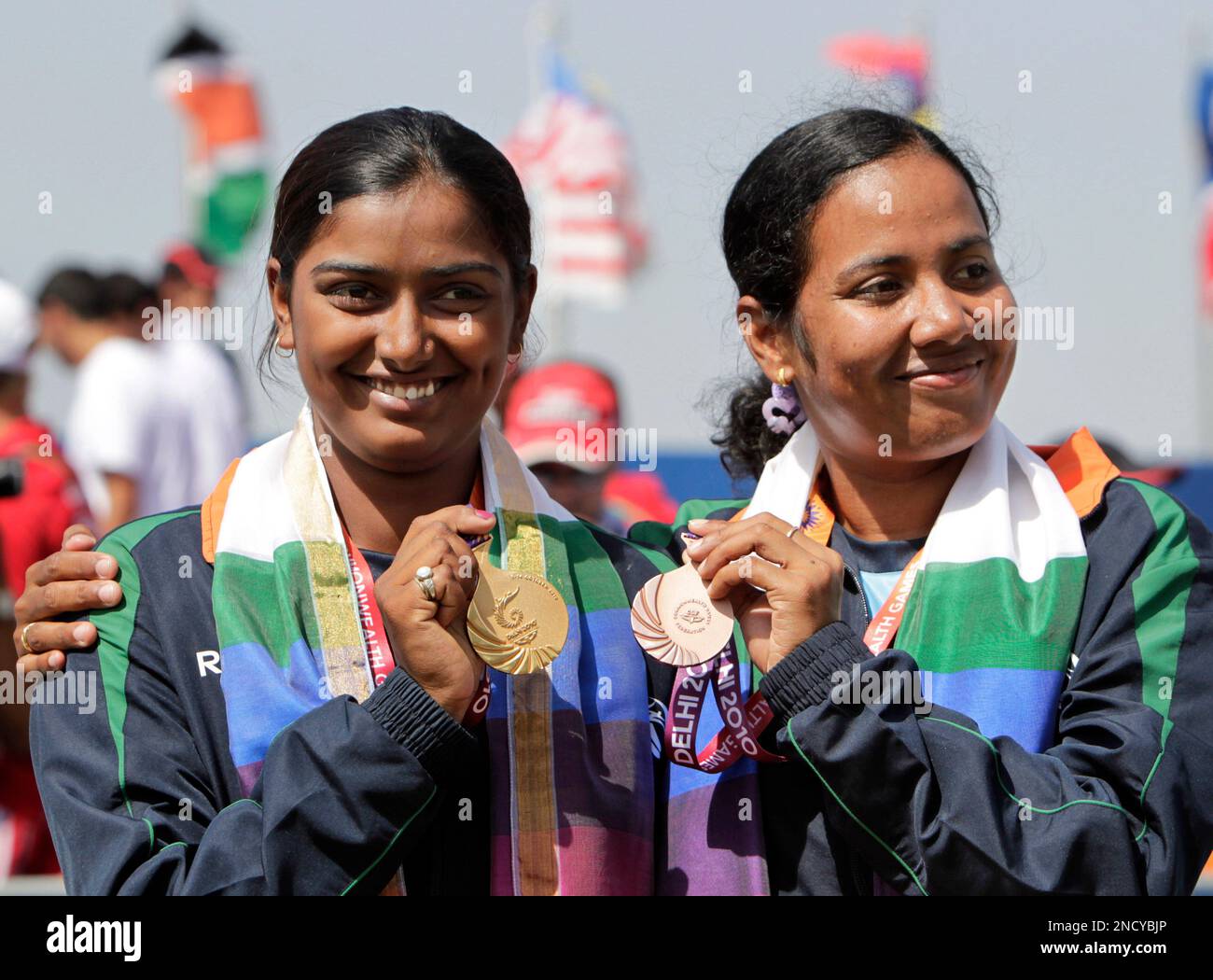 Gold winner India's Deepika Kumari, left, and bronze winner India's ...