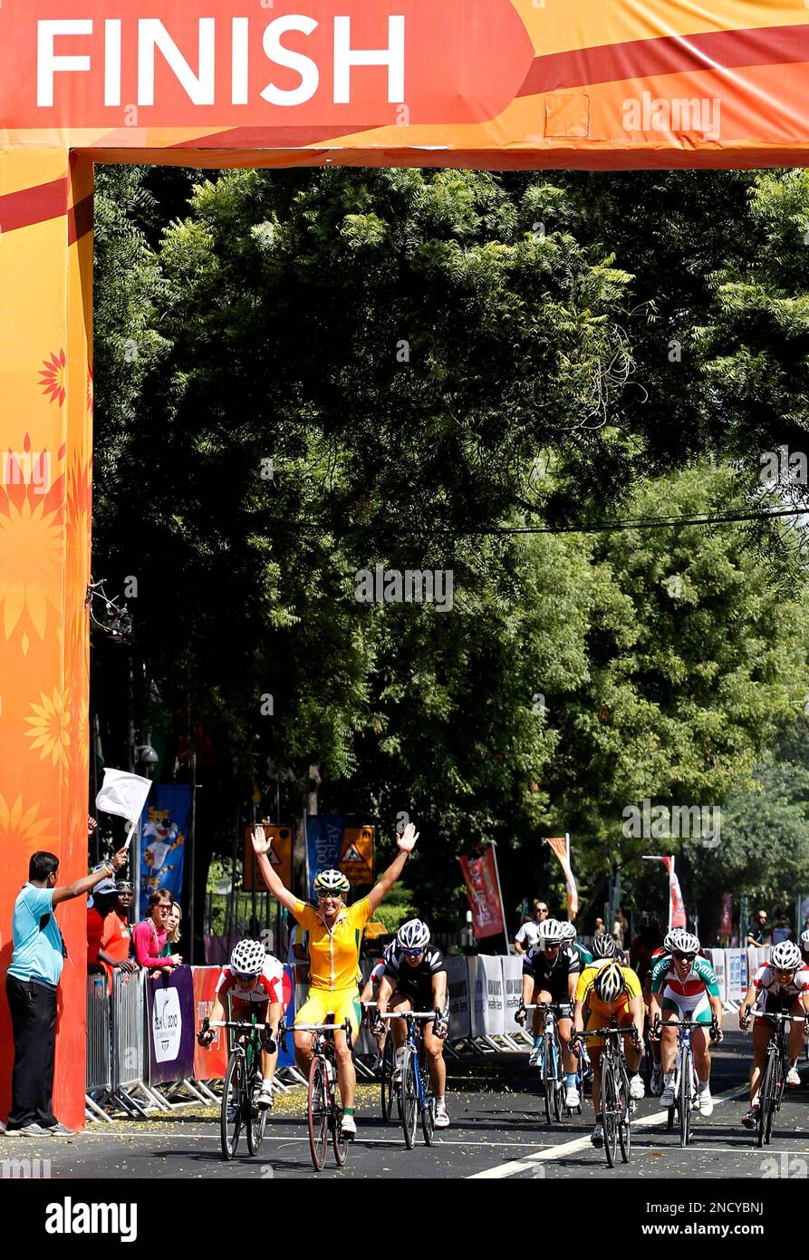 Australia's Rochelle Gilmore throws up her arms as she finishes to win ...