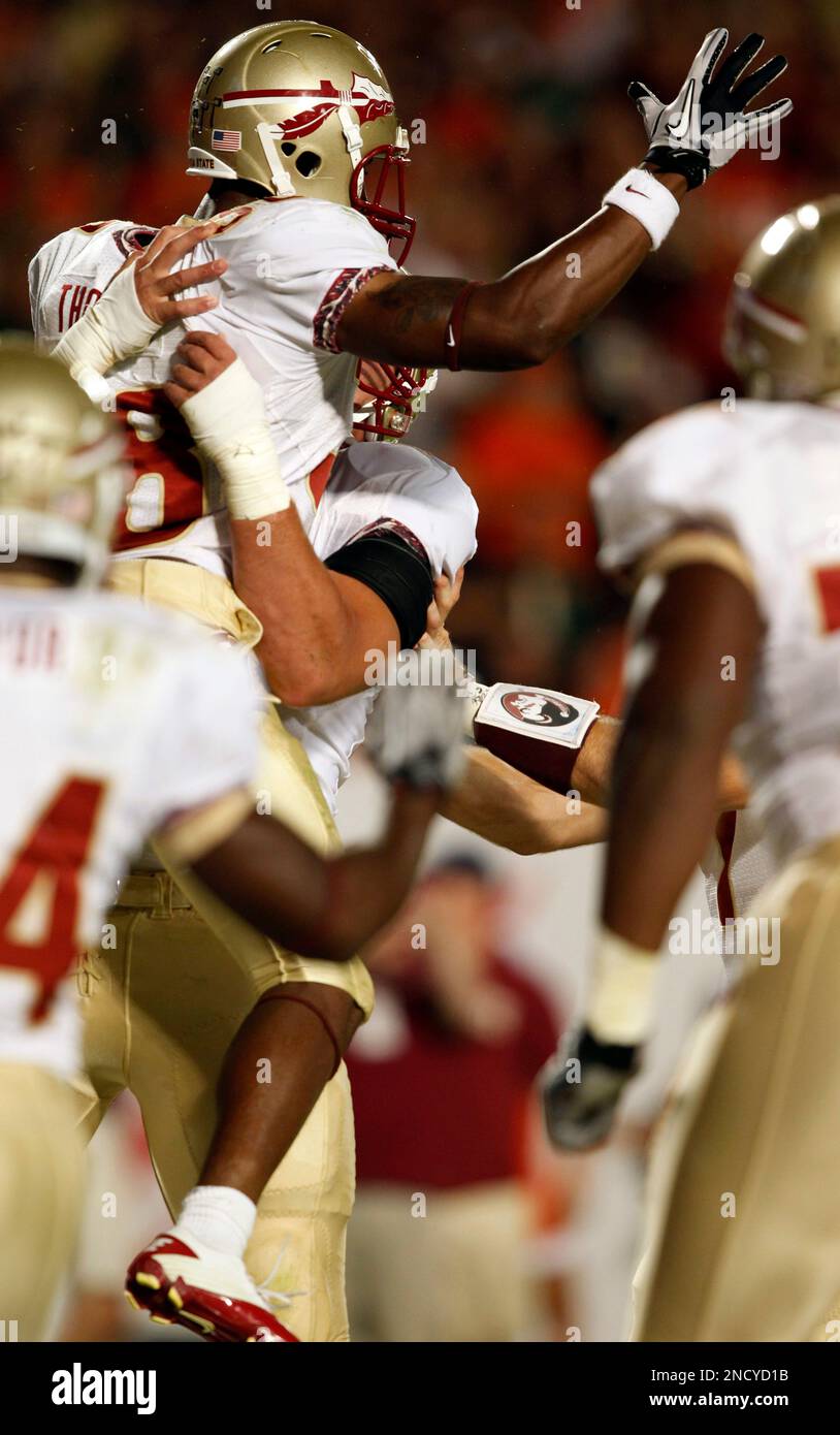 Florida State Seminoles running back Jermaine Thomas, left, celebrates ...