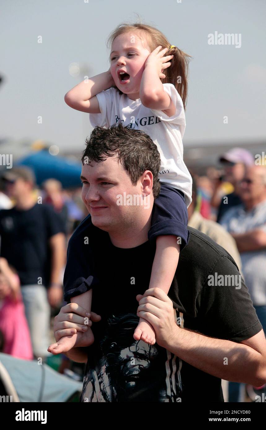 Haley Bishop, 4, sits on her uncle, Noah Bishop's, shoulders while the ...
