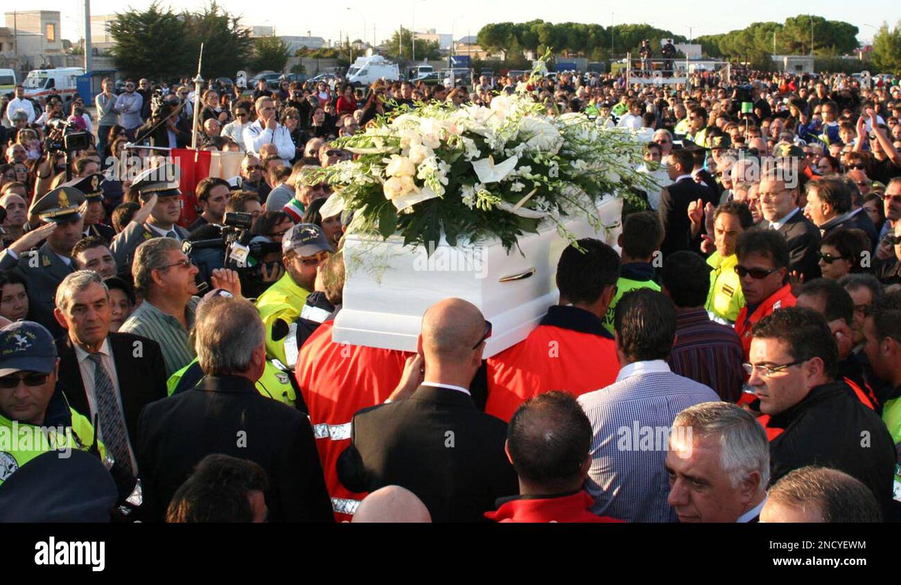 The coffin of 15-year-old Sarah Scazzi is carried through the crowd ...