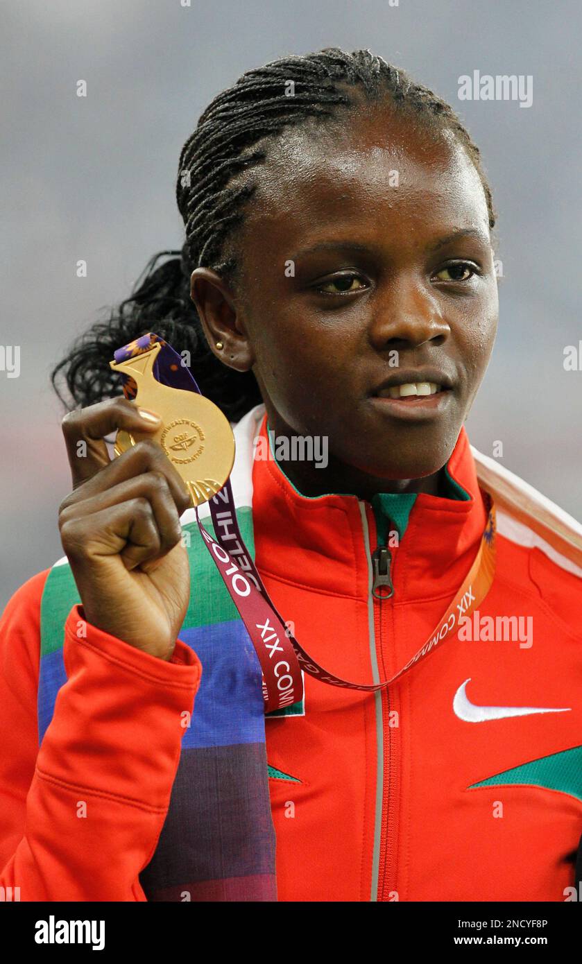 Kenya's Grace Momanyi poses with her gold medal for the Women's 10000m ...