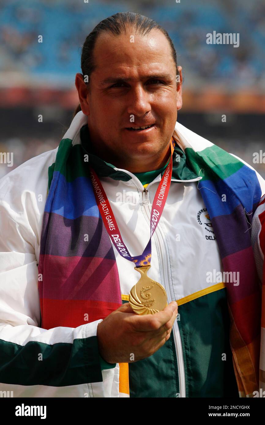 South Africa's Christiaan Harmse poses with his gold medal for the Men ...