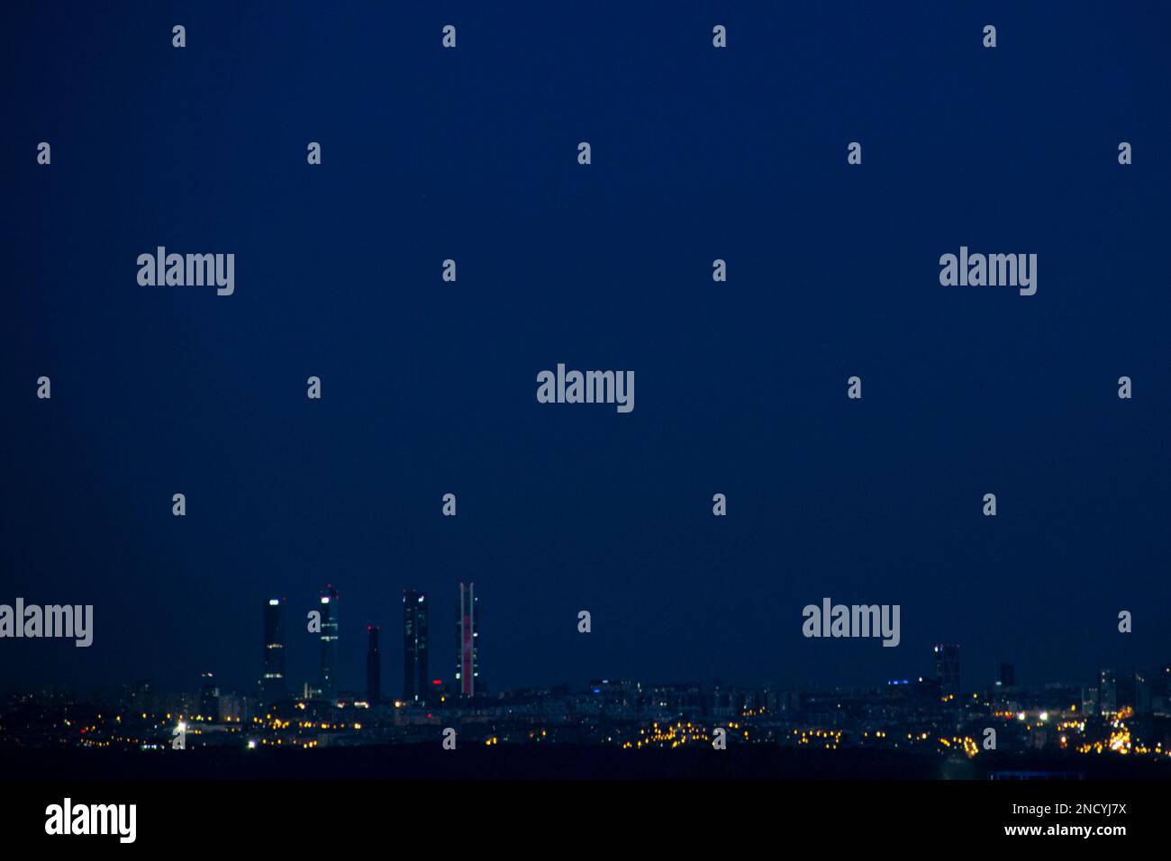 The four towers of Madrid, actually five, at night. You can see the ...