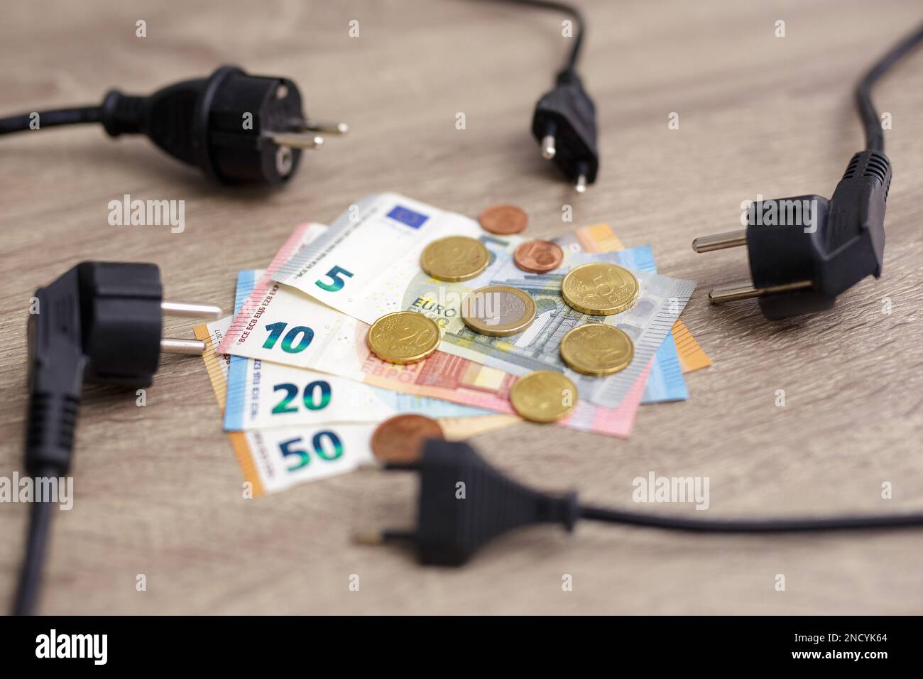 expensive electricity concept - close up of electric power plugs and ...