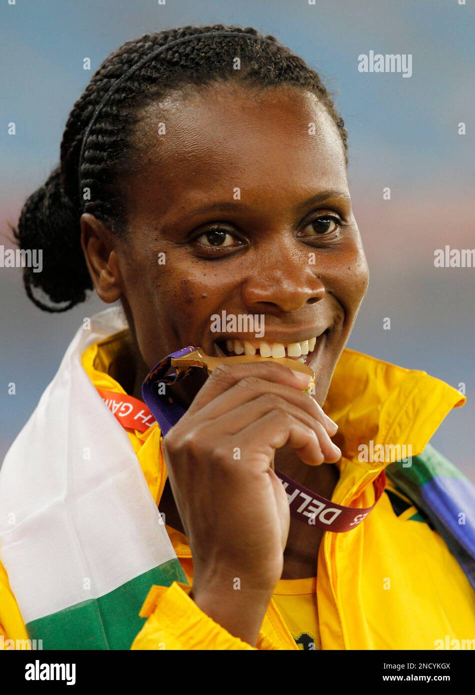 Jamaica's Trecia Smith poses with her gold medal for the Women's Triple ...