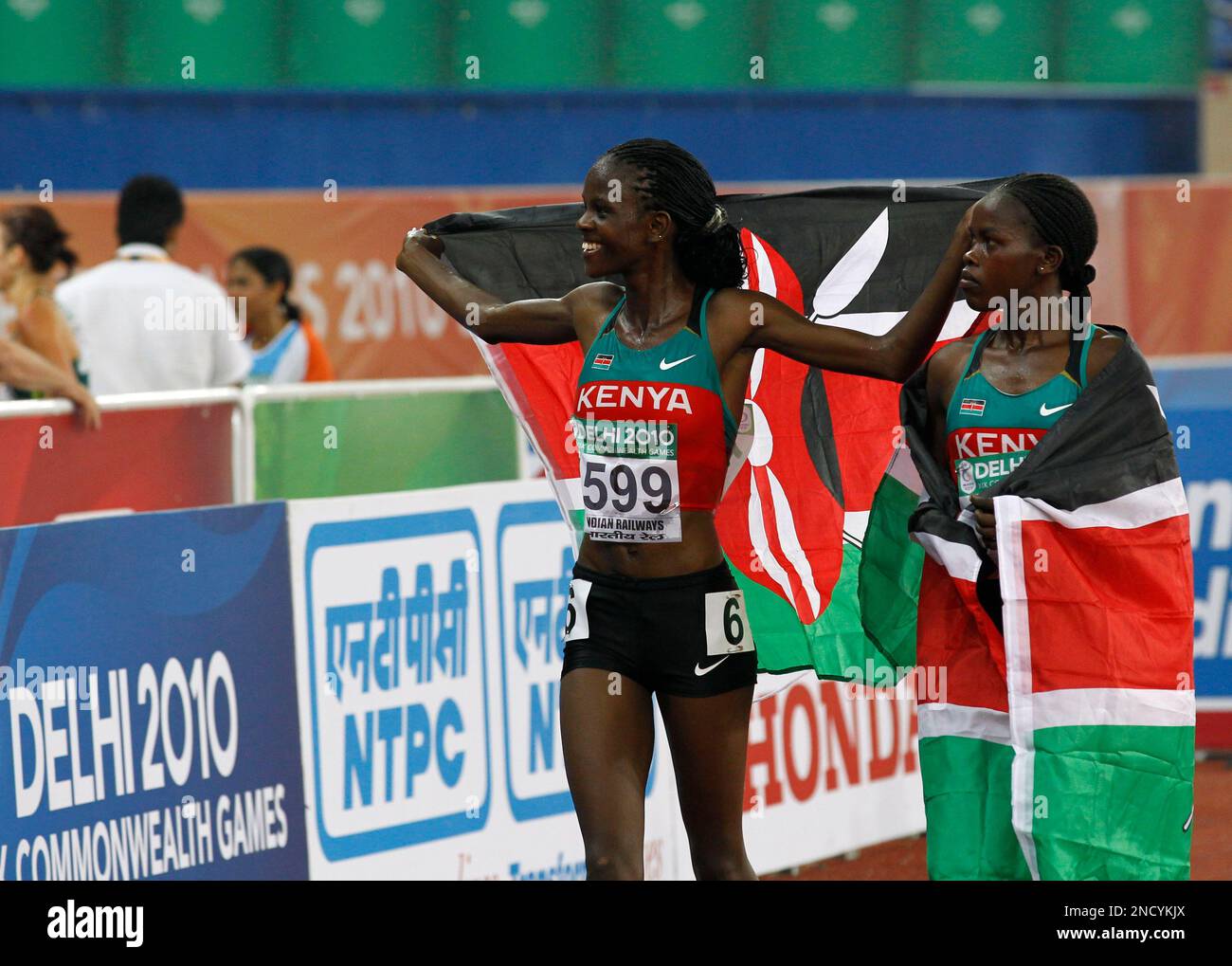 Kenya's Grace Momanyi, left, and Kenya's Doris Changeywo, right, are ...