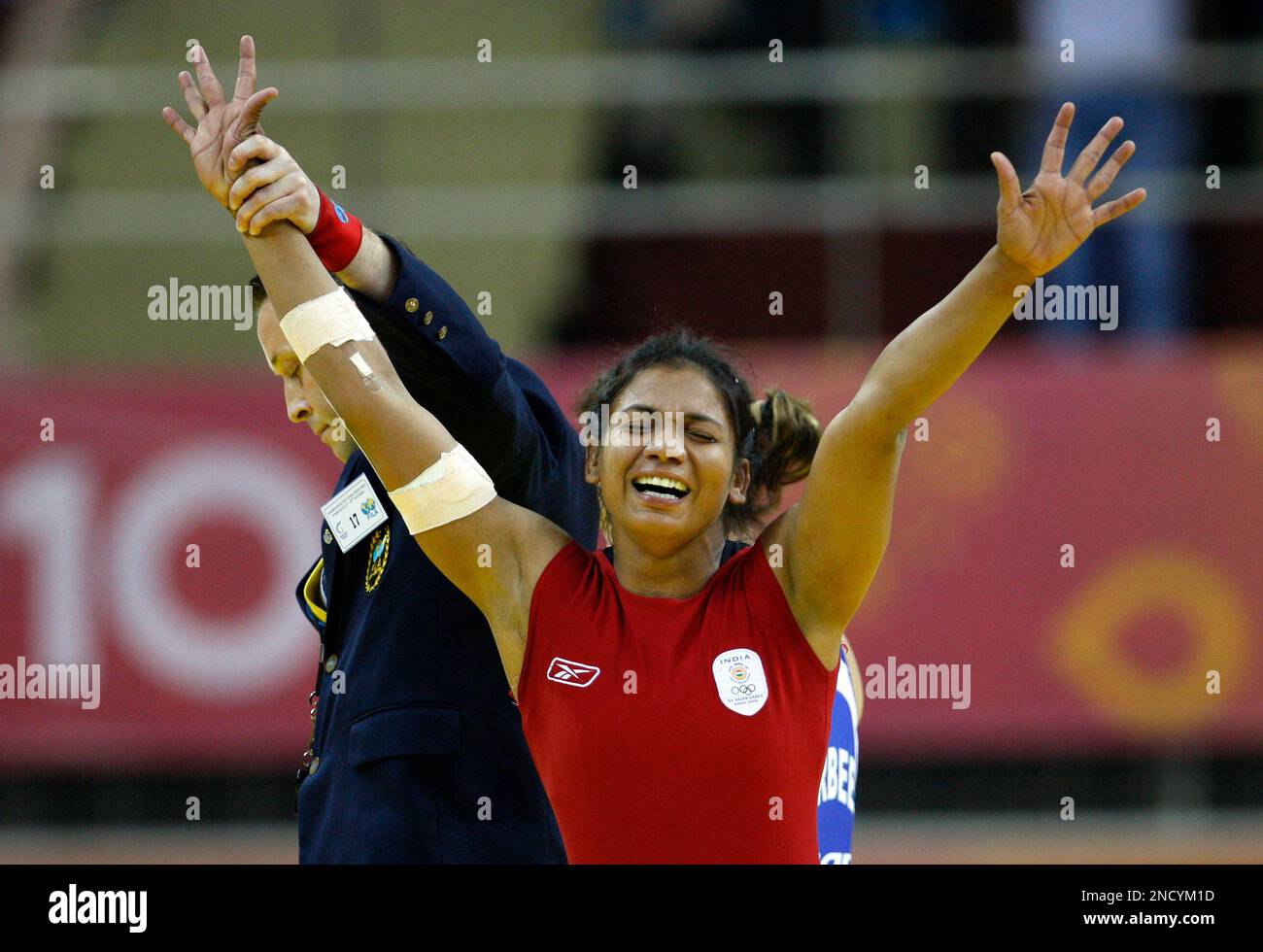 India's Alka Tomar reacts as she is declared winner in the women's 59kg ...