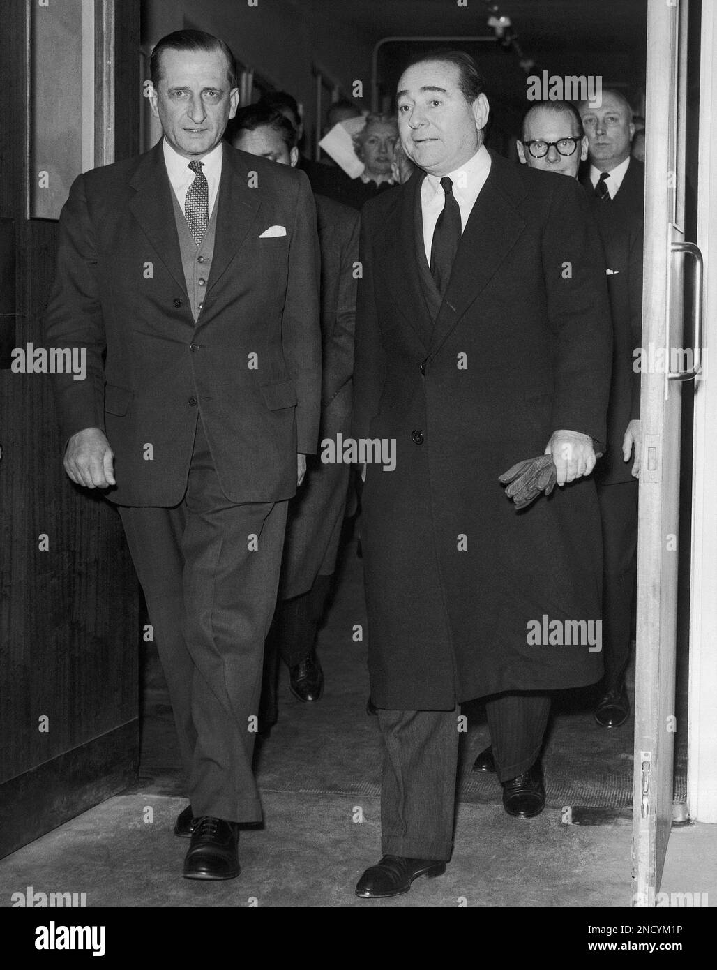 Turkish Premier Adnan Menderes, right, walks with Mr. A. E. Stevens ...