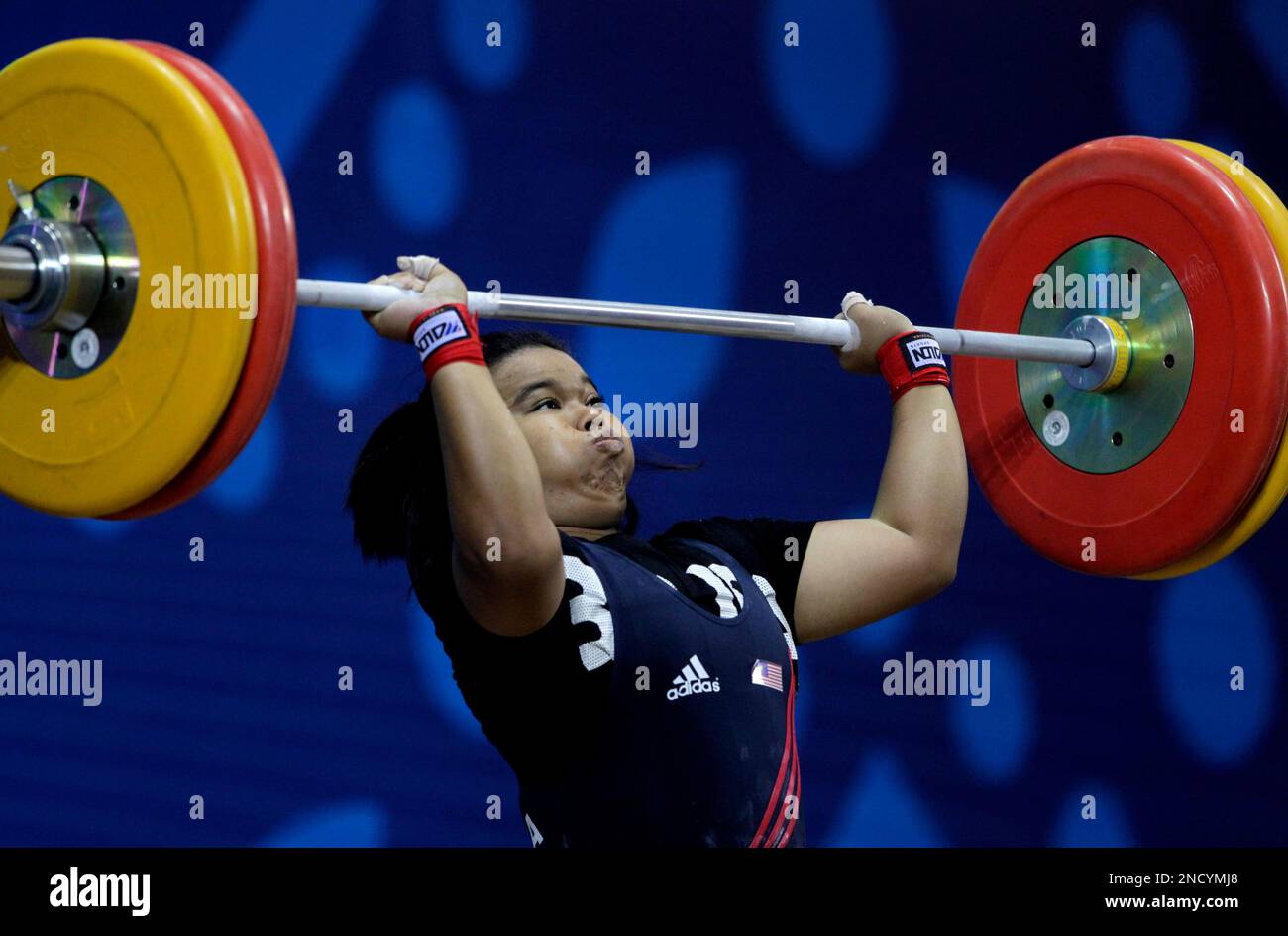 Malaysia's Nor Khasida Halim lifts a weight in the women 69kg ...