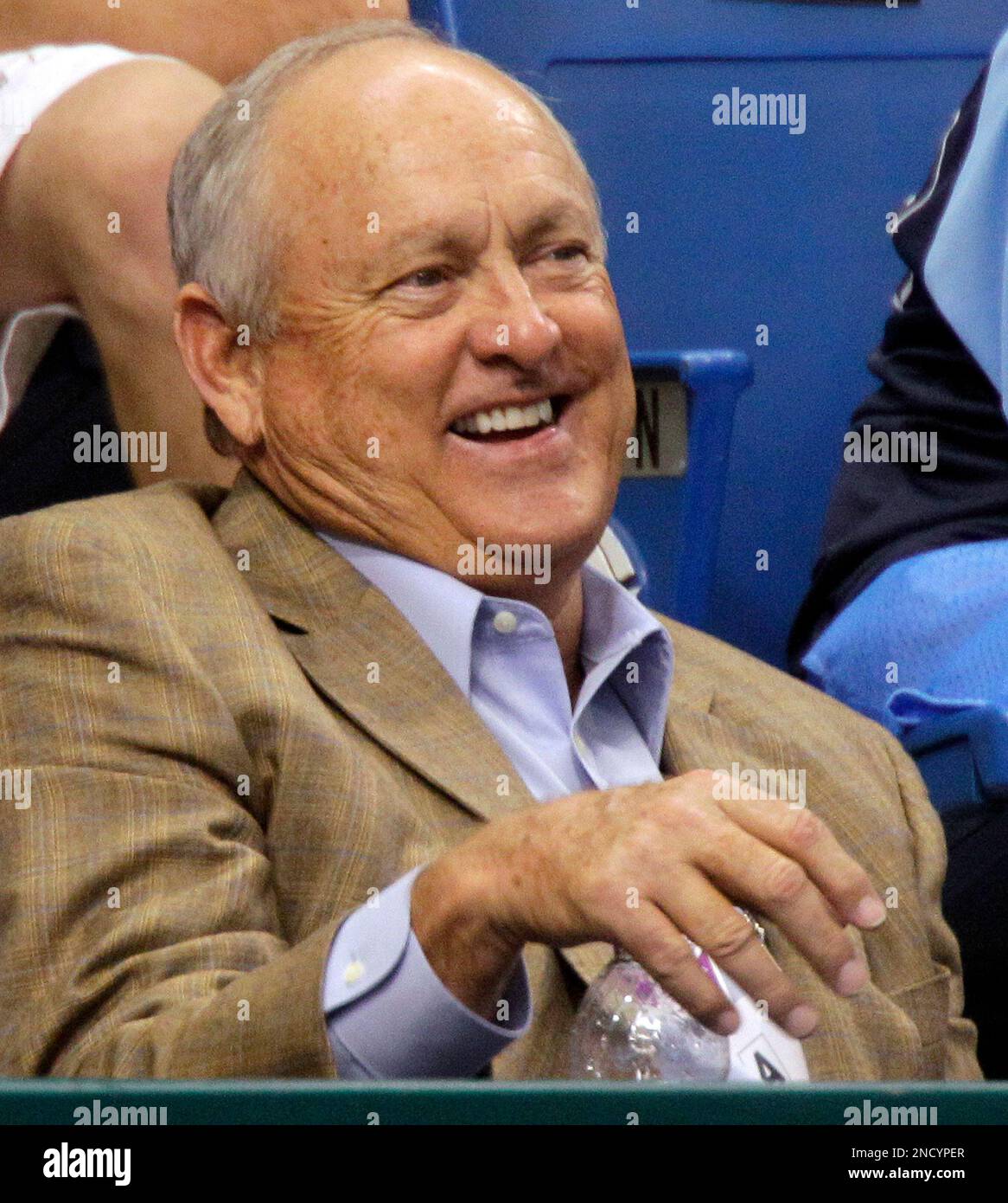 Texas Rangers co-owner Nolan Ryan smiles during the seventh inning of ...
