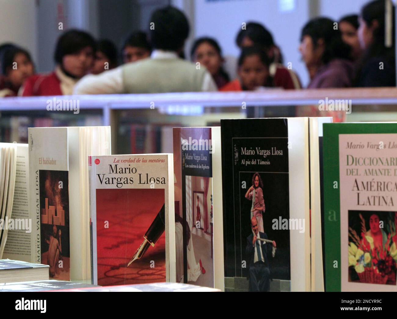Books by Peruvian writer Mario Vargas LLosa sit on display at a public ...