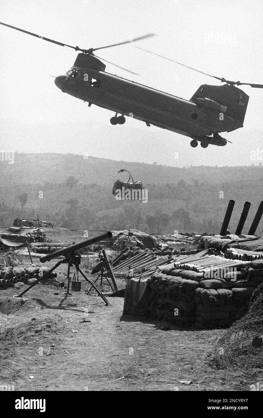 U.S. Army Chinook helicopter hastily drops its load of artillery ...