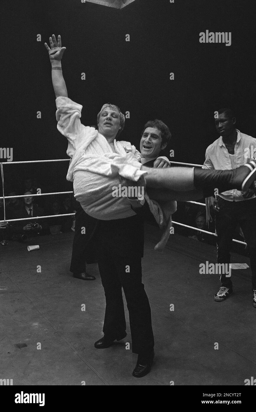 Germany’s Wilhelm von Homburg (82.7kg) is lifted by Austrian singer and ...