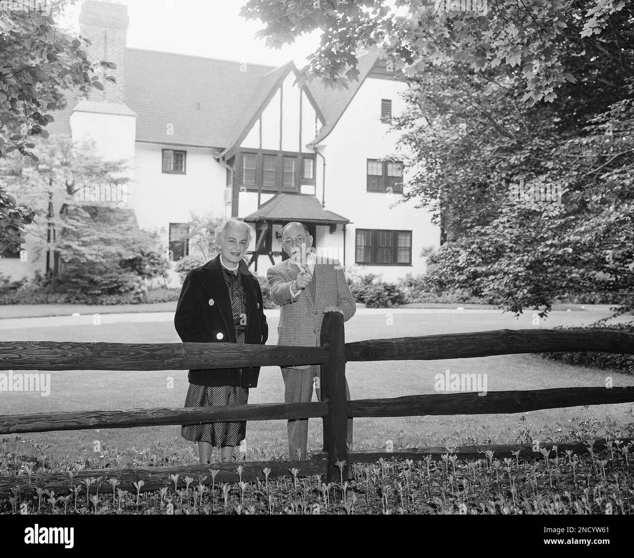 Sidney J. Weinberg, investment banker with his wife, Helen, in front of ...
