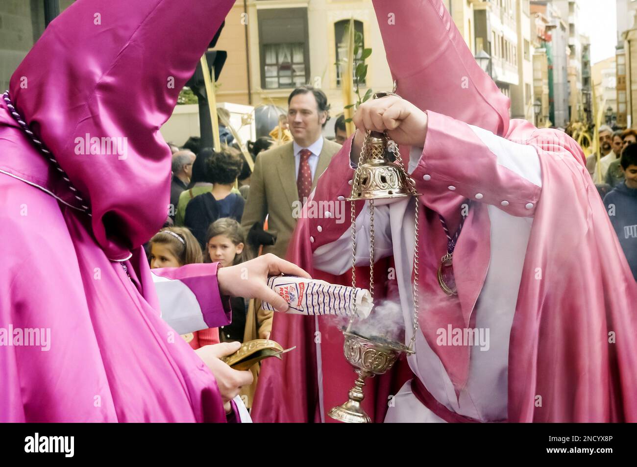 Holy Week in Zamora, Spain. Incense held in the hand of a penitent is ...