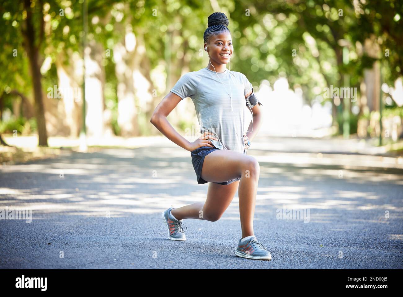 Black woman, fitness and stretching legs in preparation for running ...