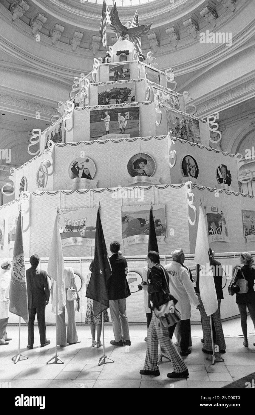 Early visitors view the finished 5-story tall Bicentennial Birthday ...