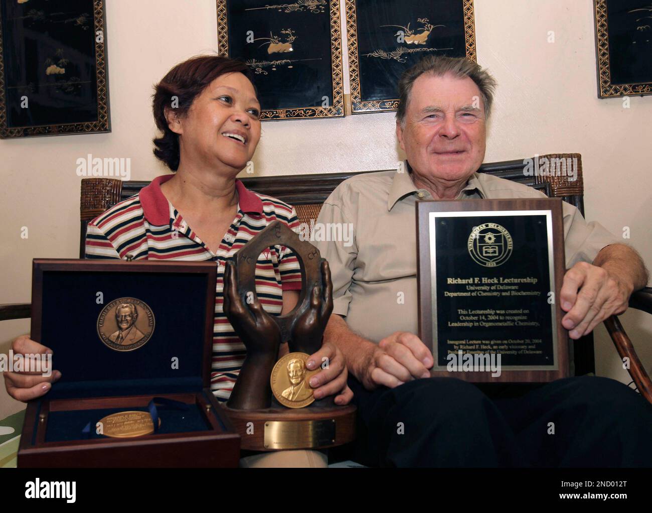American Richard Heck and his Filipino wife Socorro, display some of ...