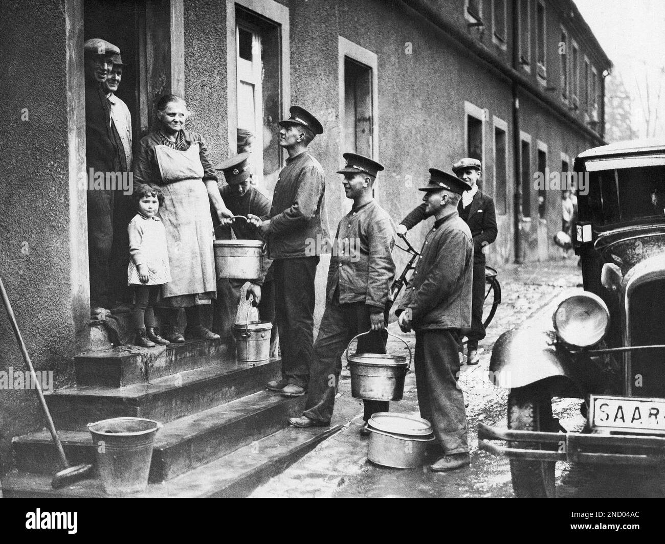 British Tommies getting water from the inhabitants at Broback in the ...