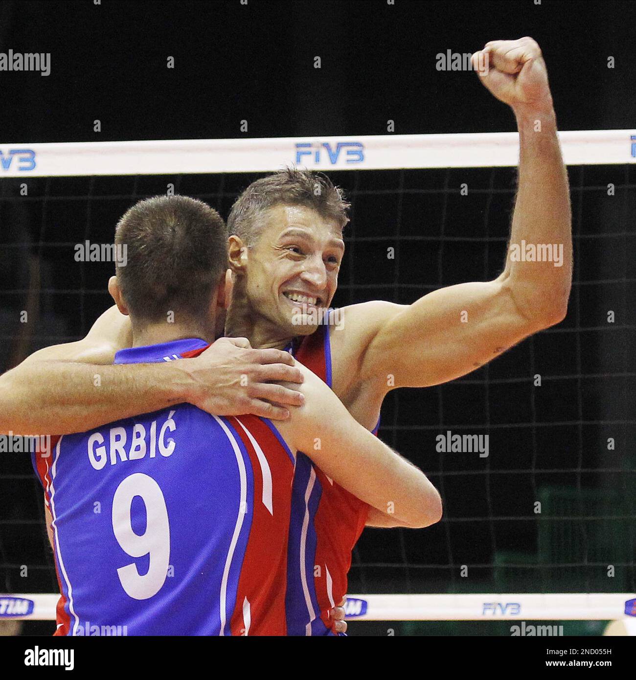 Serbia's Nikola Grbic, left, and Ivan Miljkovic celebrate after winning ...