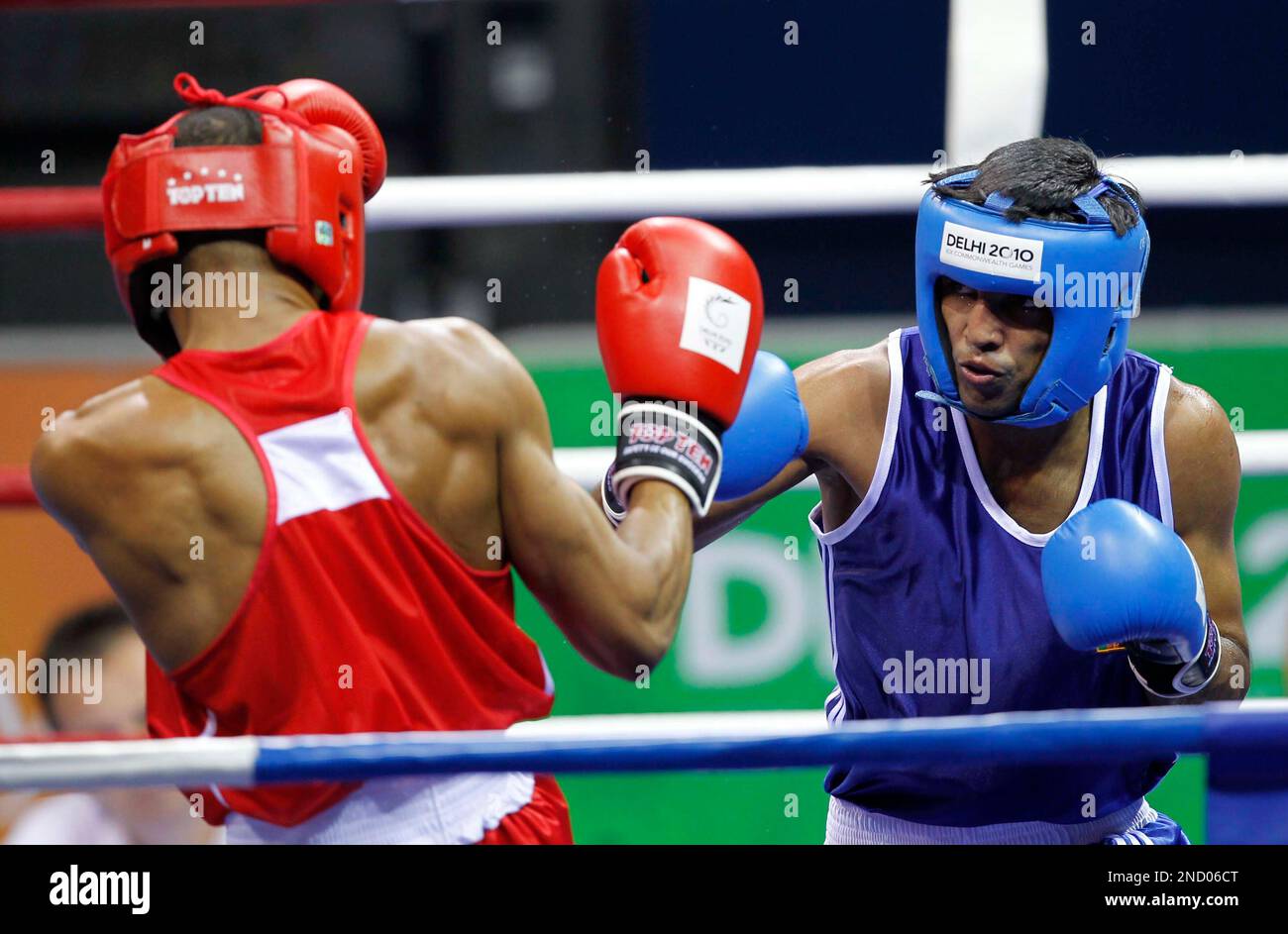 Sri Lanka's Indrajith Pransikuge, right, sends a punch to Jamica's ...