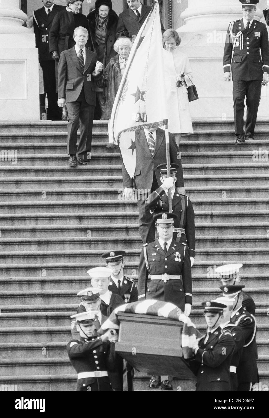 The honor guard walks down the steps of the Capitol in Washington ...