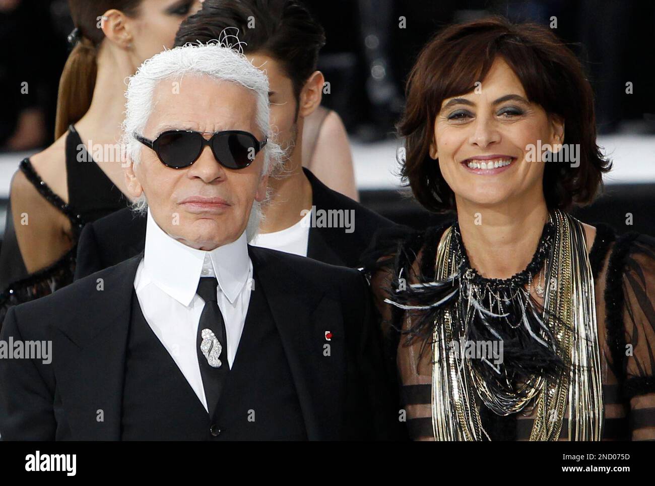 German fashion designer Karl Lagerfeld, left, and French former model ...