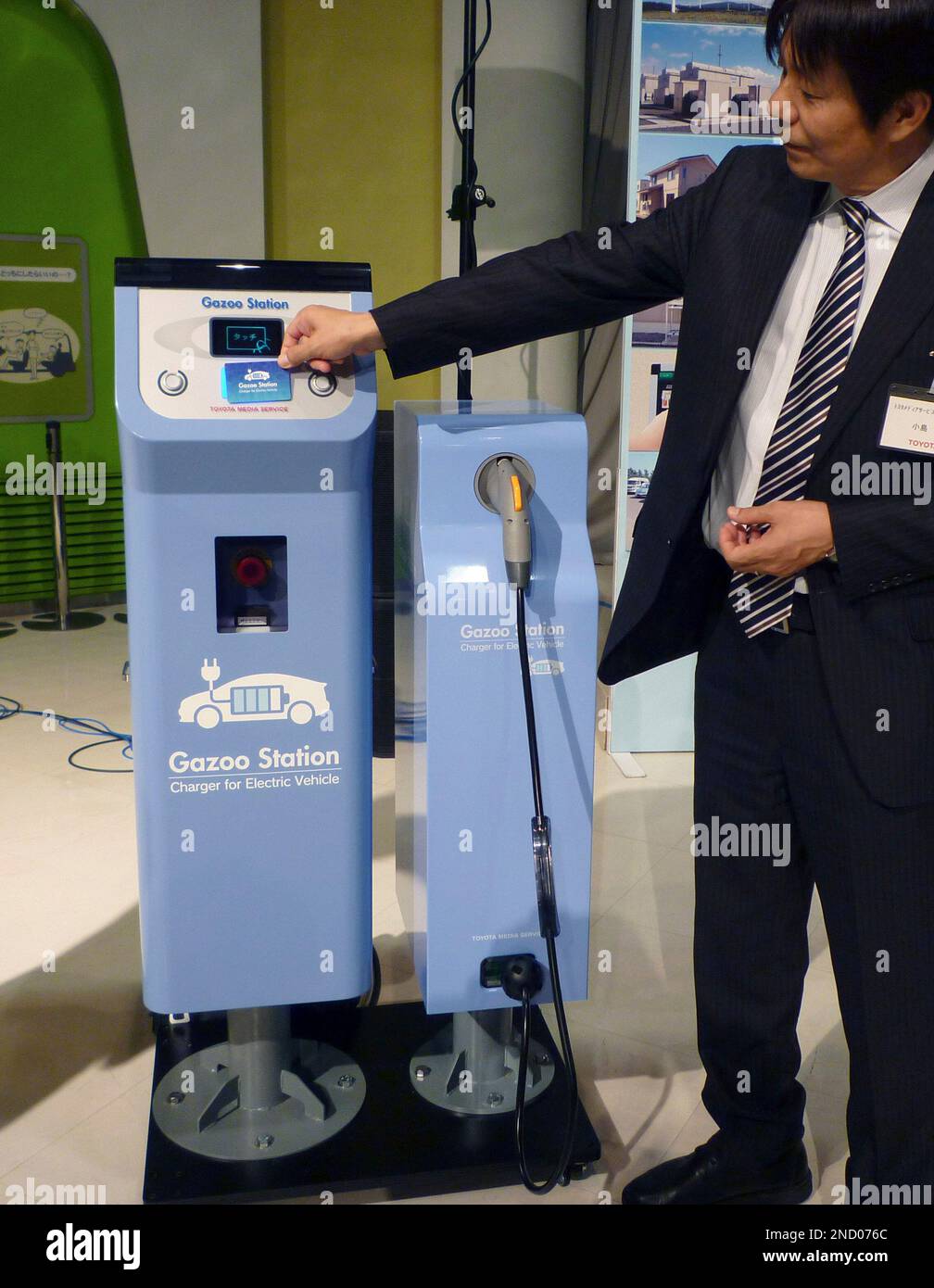 Toyota Motor Corp. employee Osamu Kojima places a card to start an ...