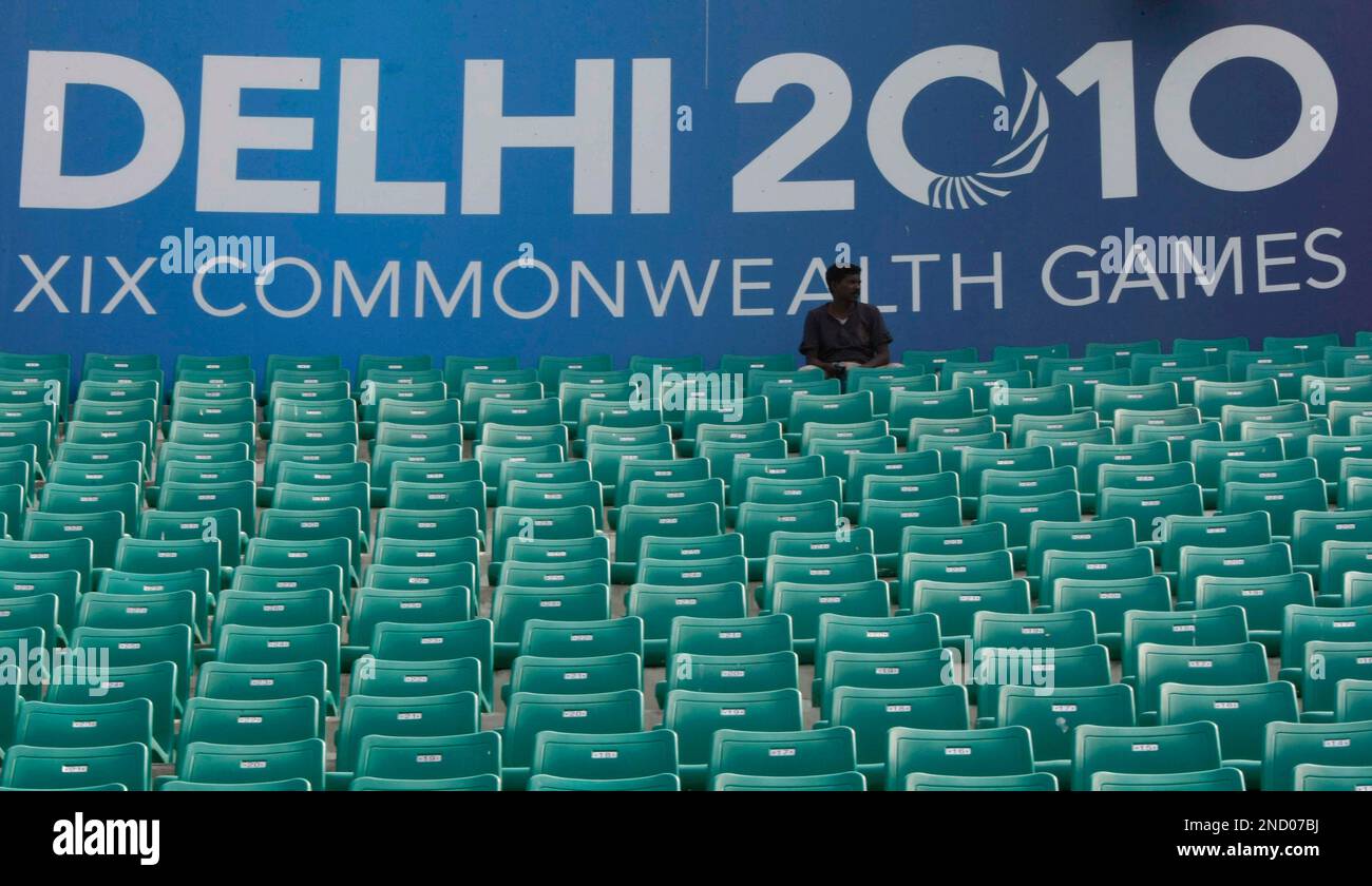 A sole spectator sits in the stand during the field hockey match ...