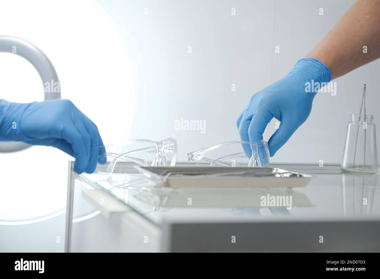 doctor nurse at same time put plastic transparent glasses on glass ...