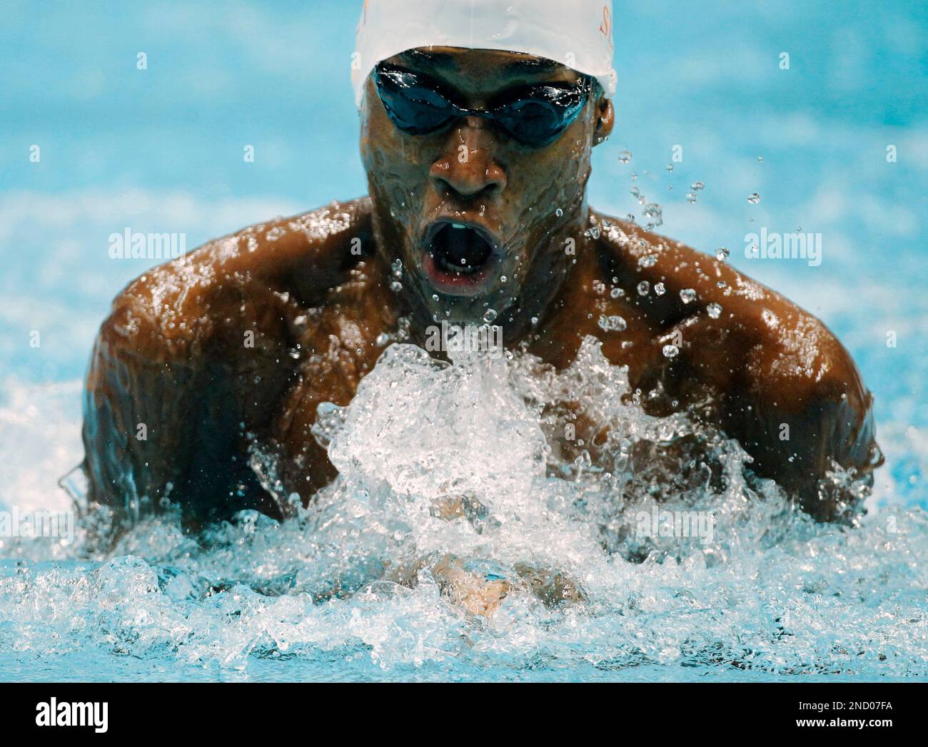Sierra Leone's Ron Roucou competes in a Men's 100m Breaststroke heat ...