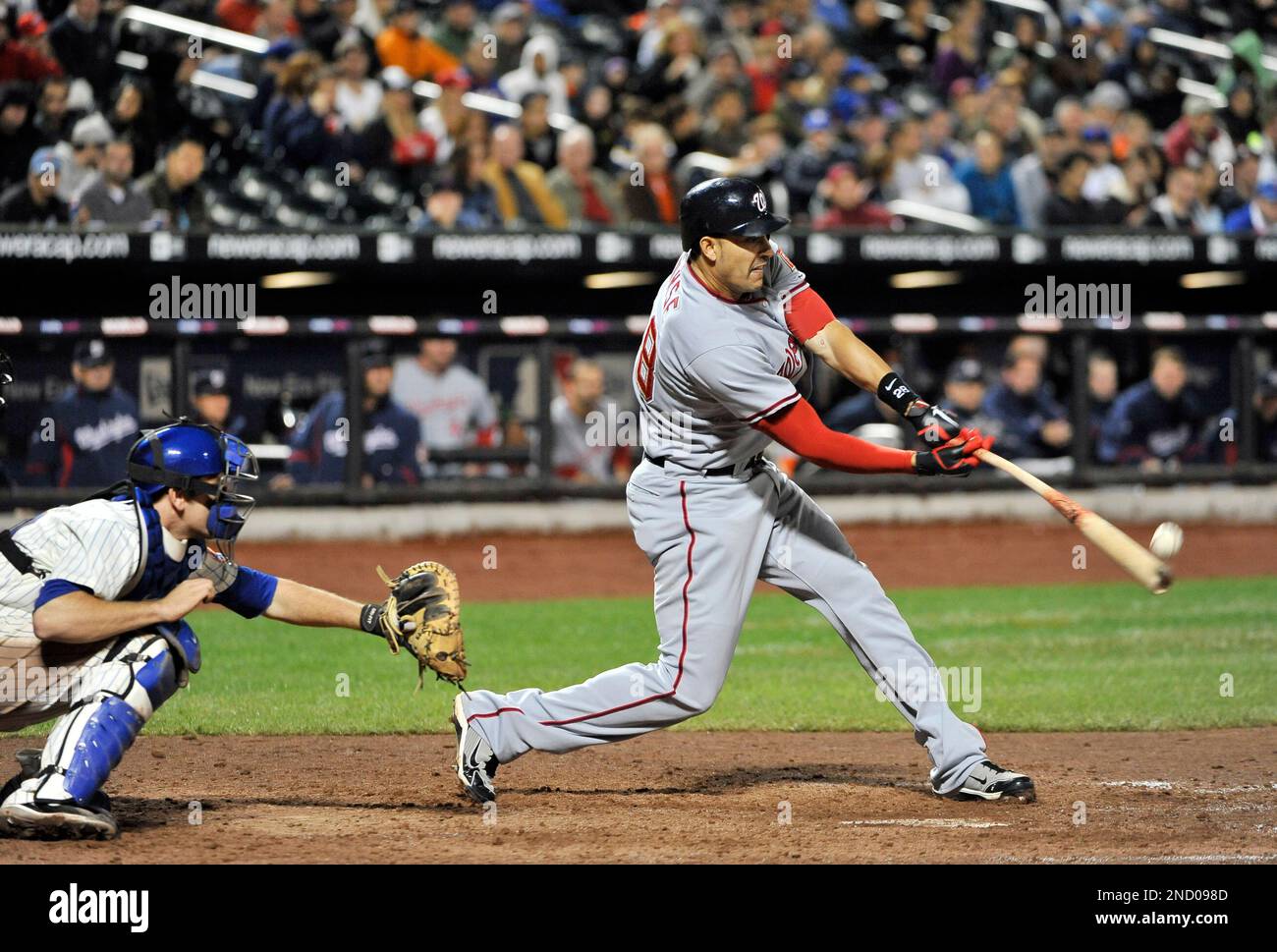 New York Mets' Josh Thole catches as Washington Nationals' Michael ...