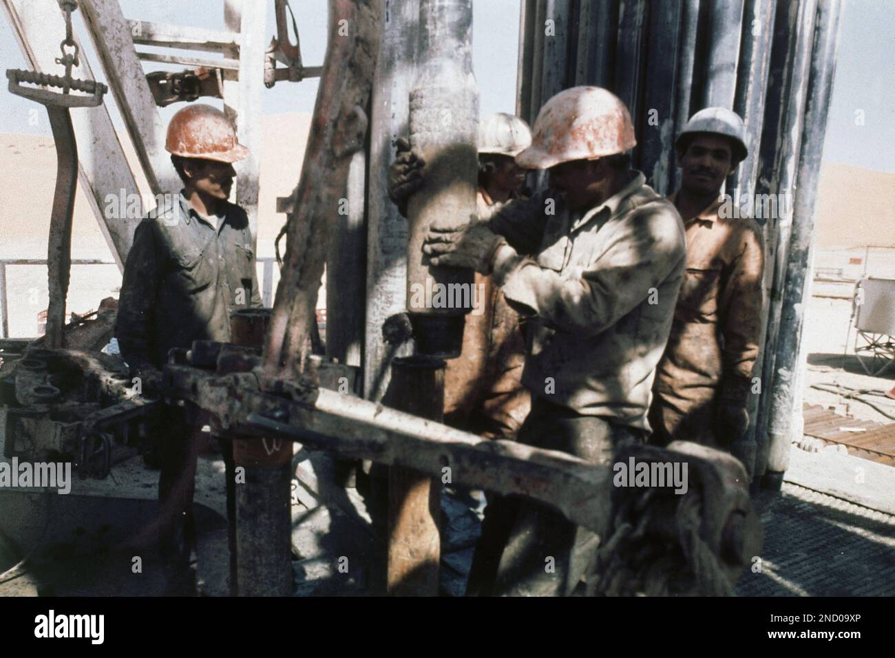 Oil workers operate the drill at the oil exploration camp named Musa 1 ...