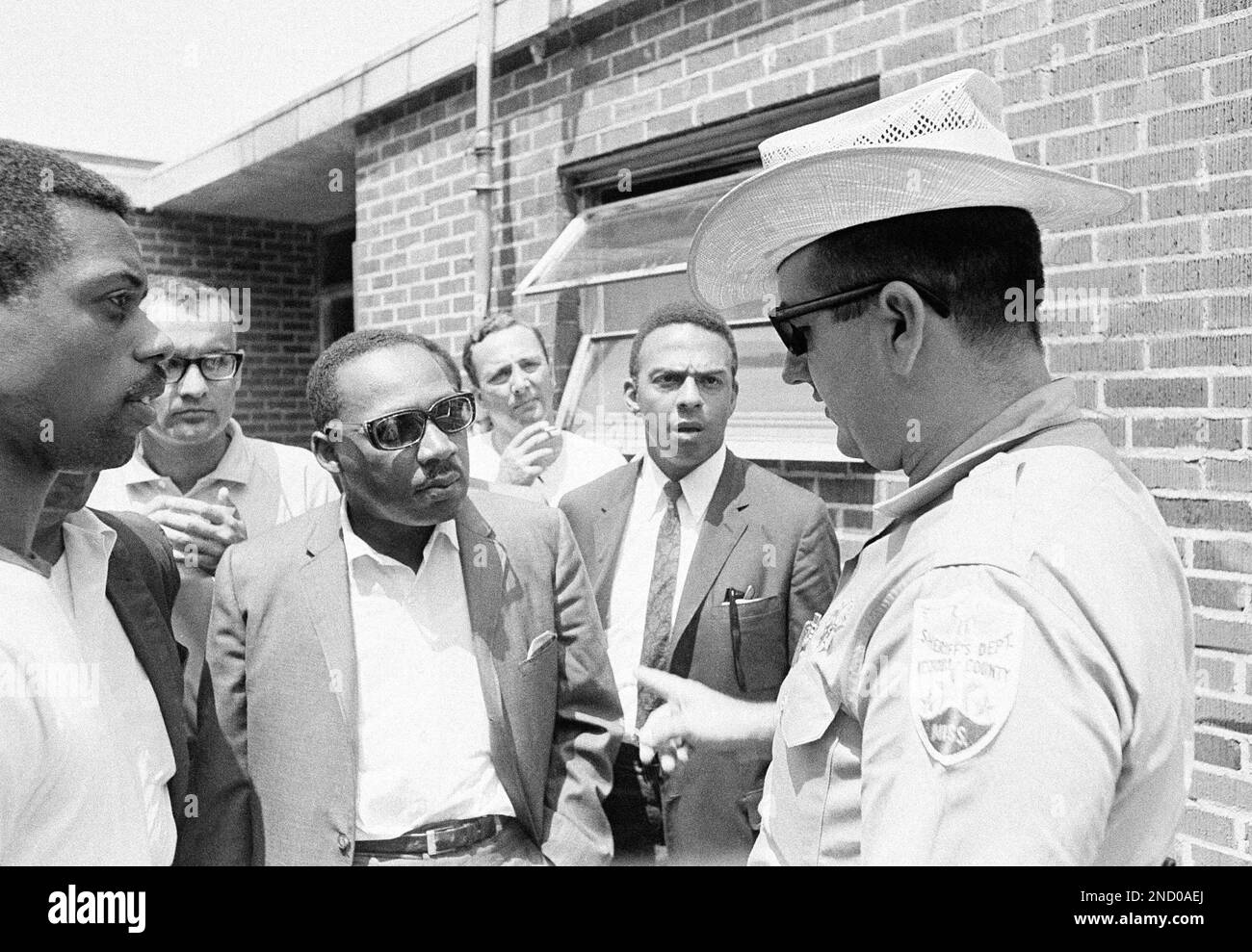 Dr. Martin Luther King, left, confronts Neshoba County Deputy Sheriff ...
