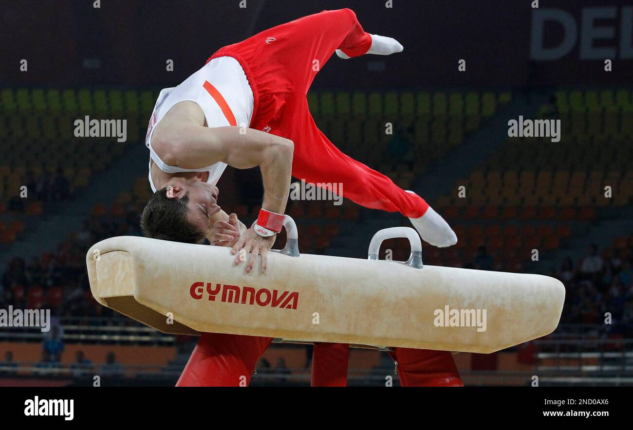 England's Steve Jehu crashes on the pommel horse during the men's ...