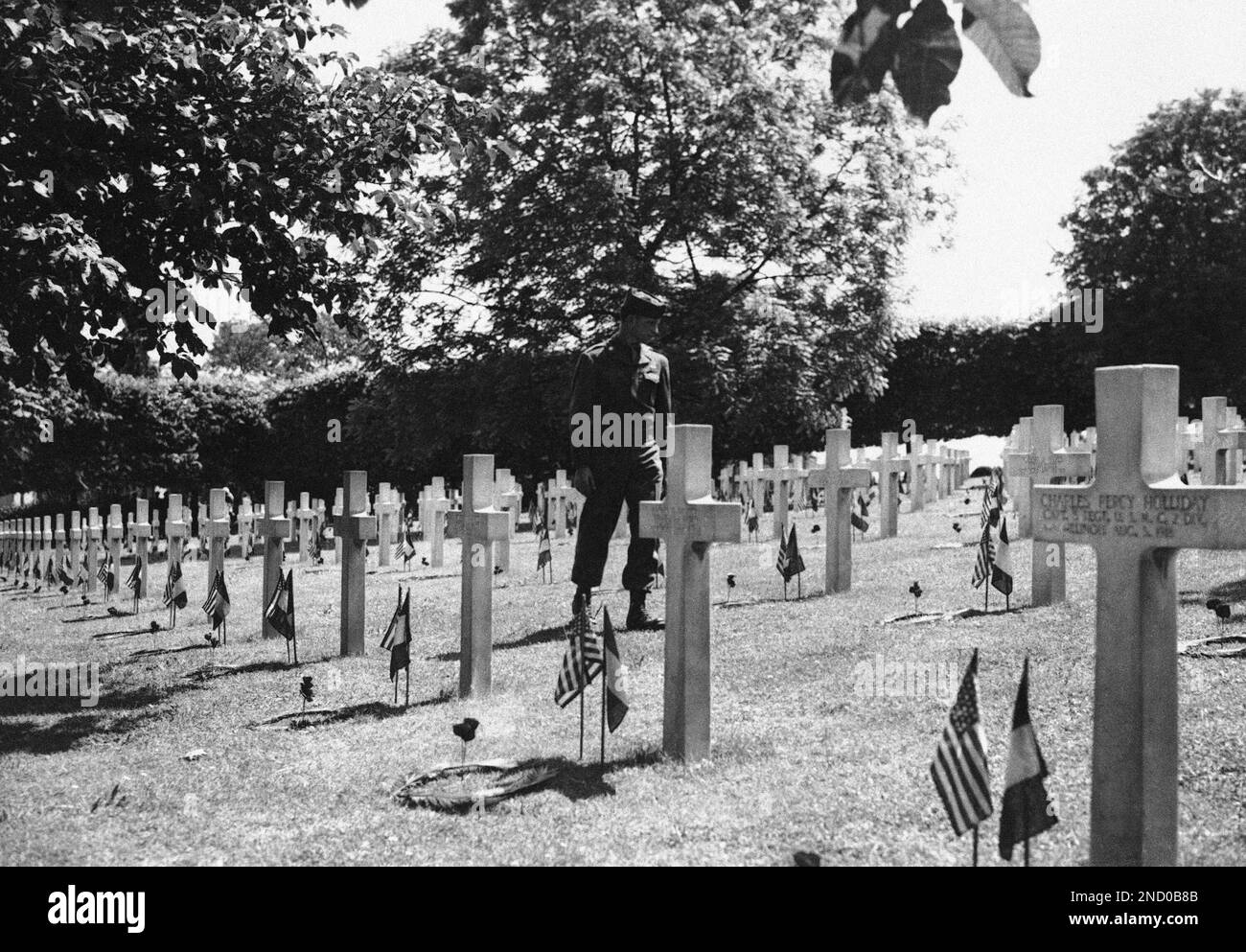 Private First Class Howard B. Bassett, looks over the graves of ...