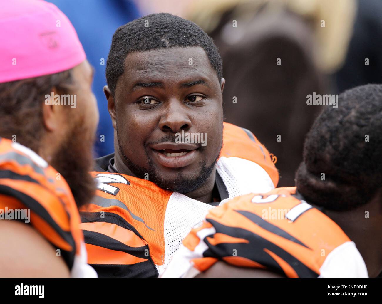 Cincinnati Bengals defensive end Frostee Rucker talks with teammates on ...