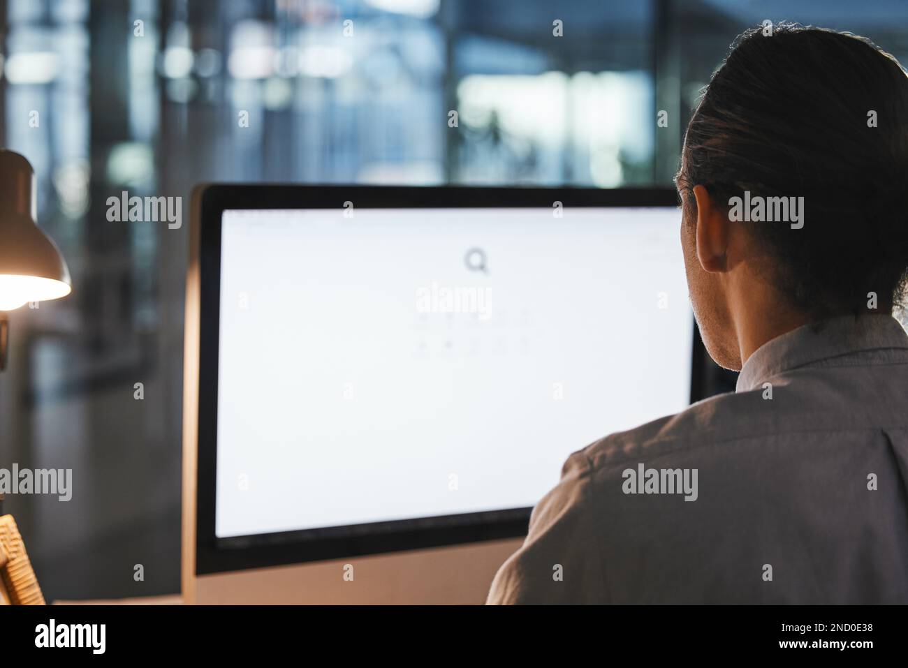 Man, computer and green screen on mockup at night for advertising ...
