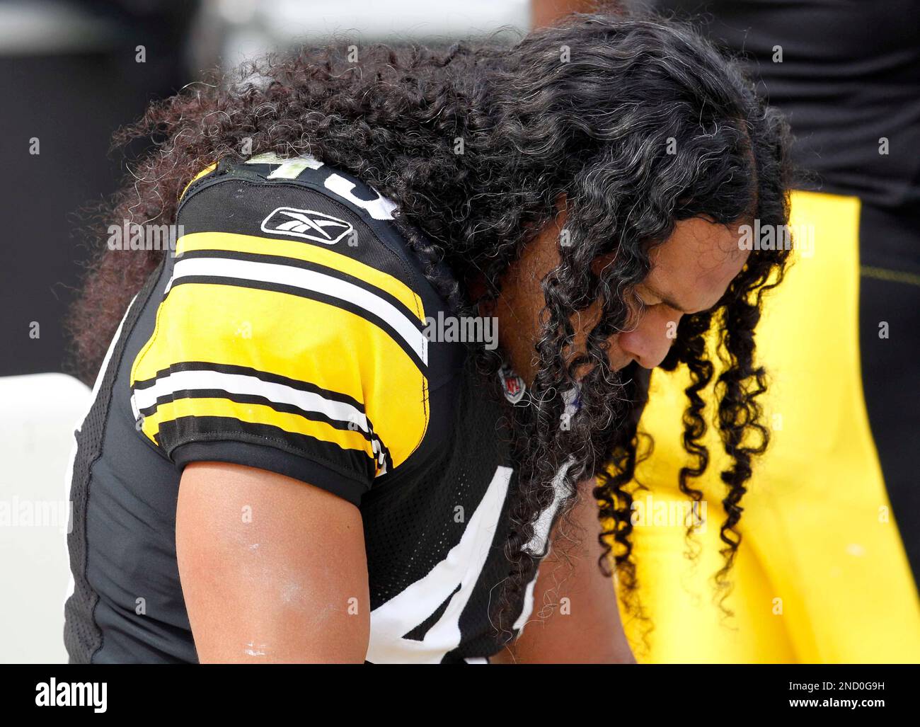 Pittsburgh Steelers safety Troy Polamalu sits on the bench in the first ...