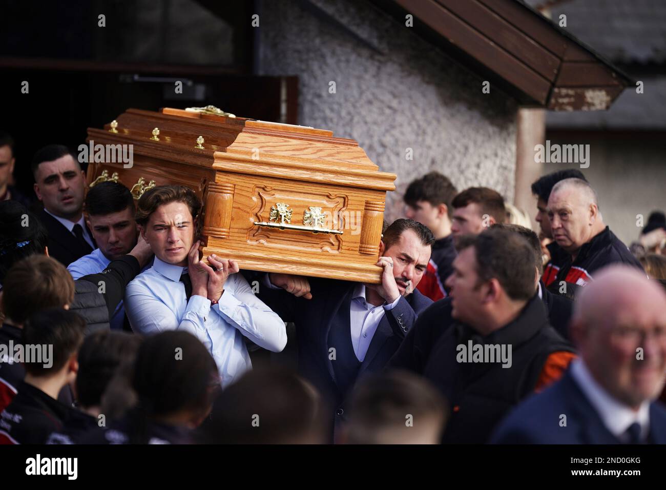 The coffin of John Keenan is carried out of the Church of the ...