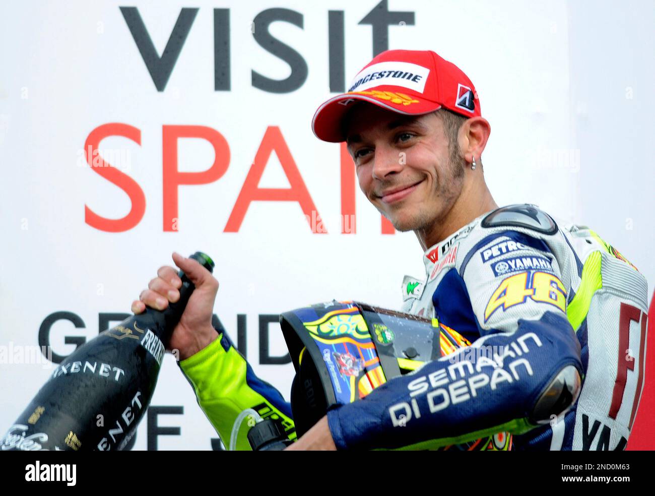 Third-placed MotoGP Yahama rider Valentino Rossi of Italy holds a ...